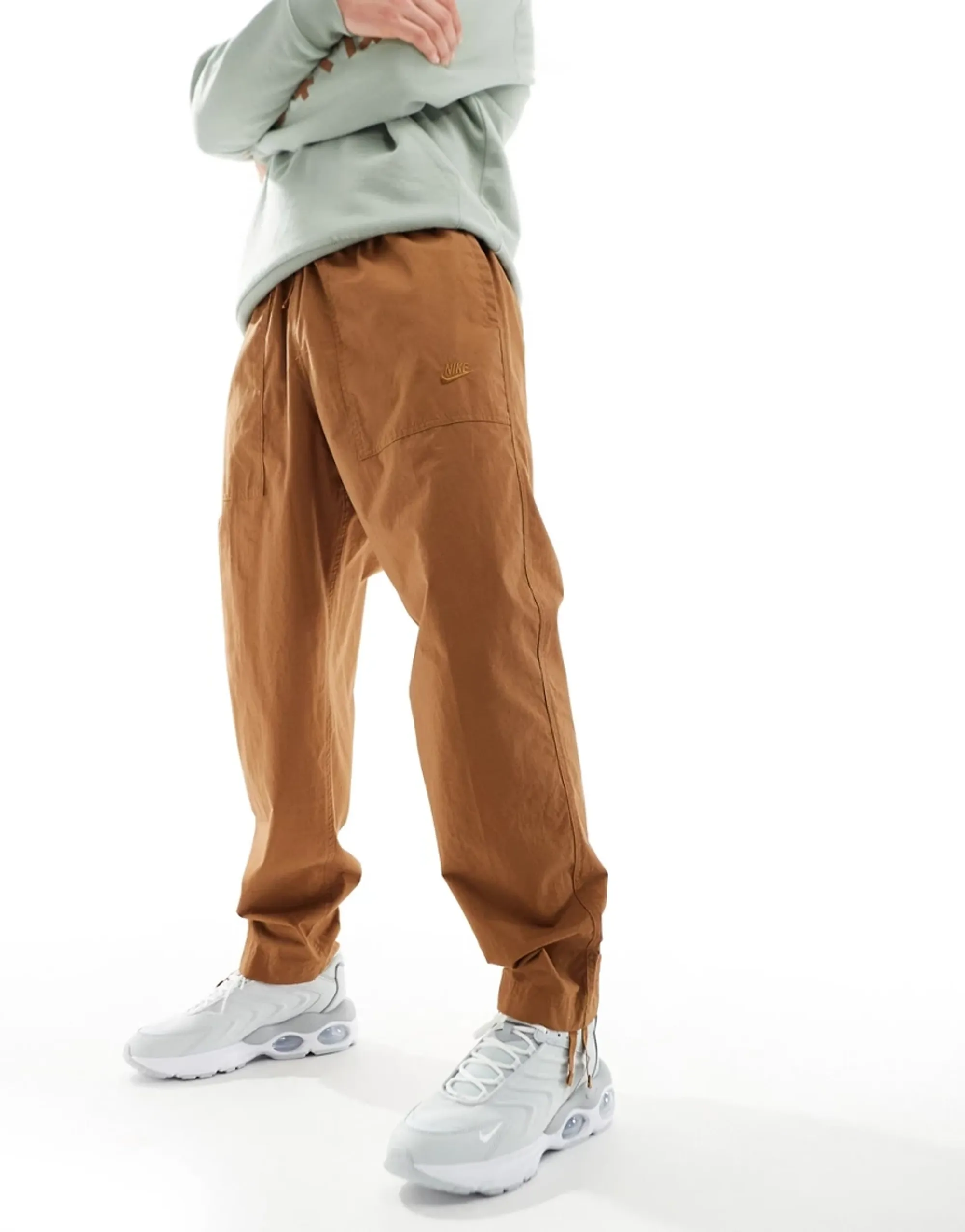 Nike Club woven Barcelona trousers in brown | FN3096-281 | FOOTY.COM